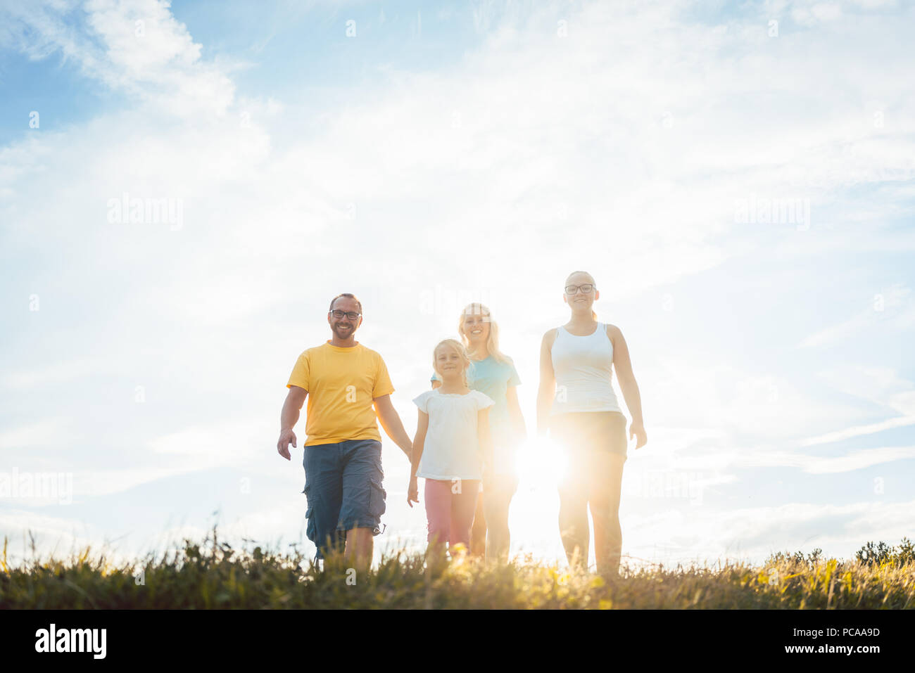 Children in happy family sunset hi-res stock photography and images - Alamy