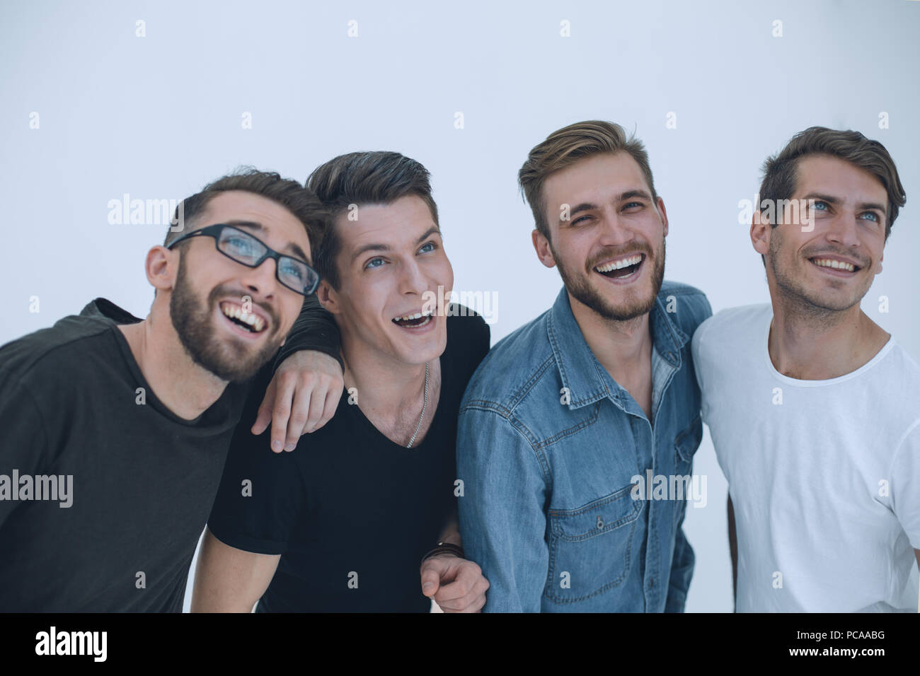 Group of young friends looking up - isolated over white Stock Photo - Alamy