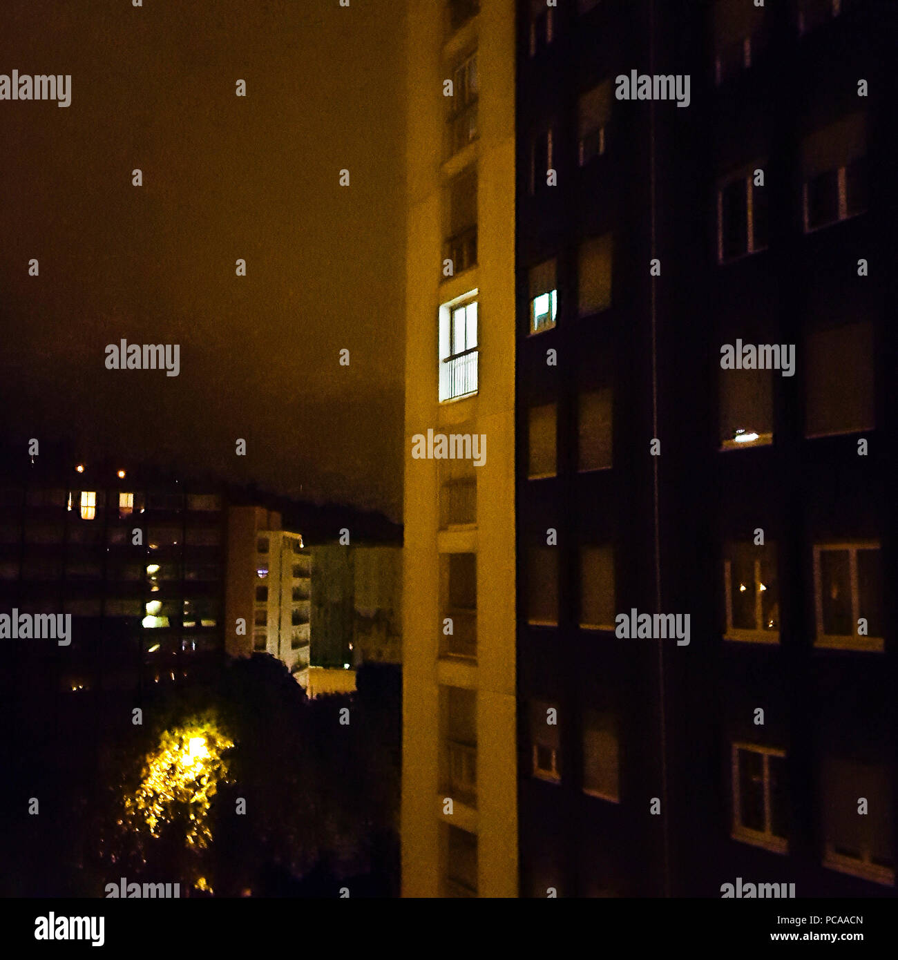 Apartment building at night Stock Photo - Alamy
