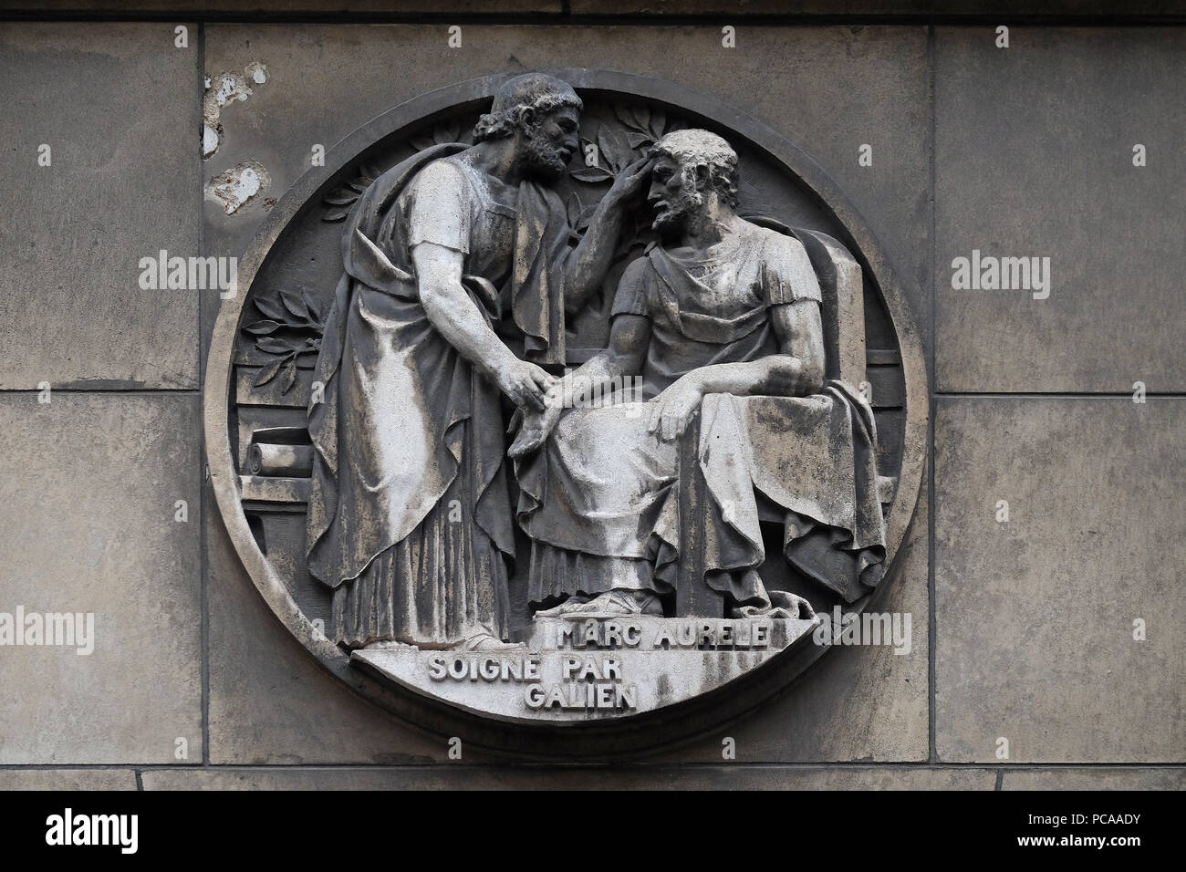 Marc Aurele heals by Galen. Stone relief at the building of the Faculte ...