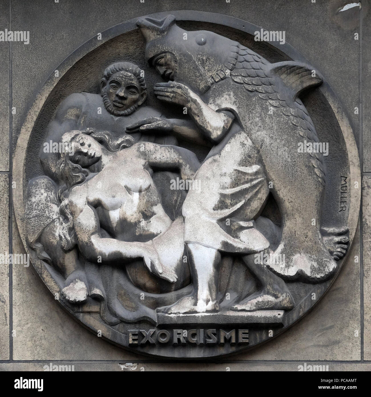 Exorcism. Stone relief at the building of the Faculte de Medicine Paris ...
