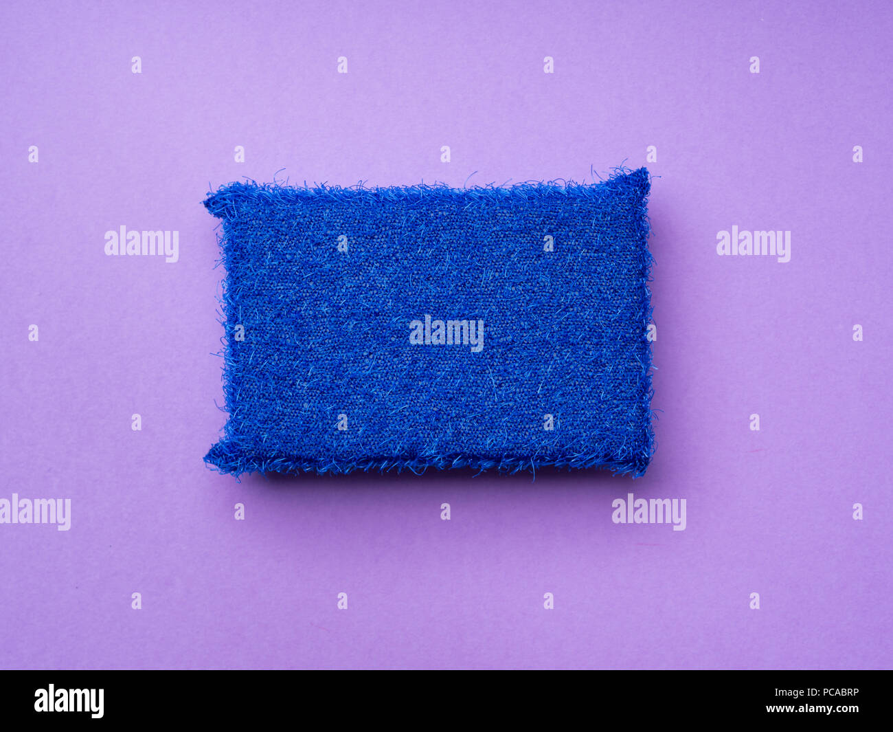Cleaning sponge on purple background. Minimal cleaning concept Stock ...