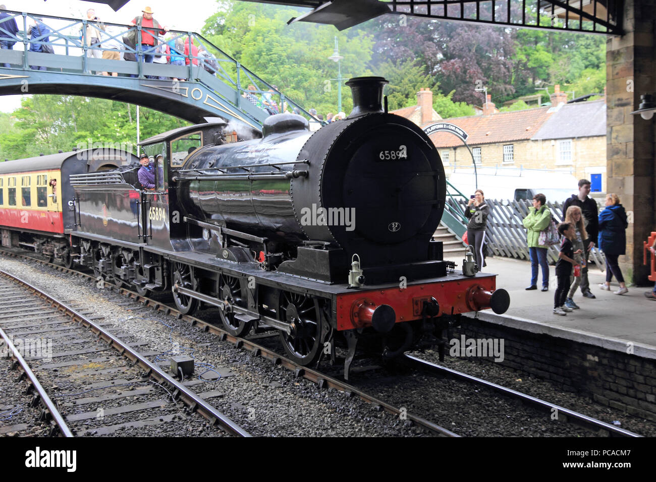 Steam locomotive 65894 arriving at station, Pickering, North Yorkshire ...