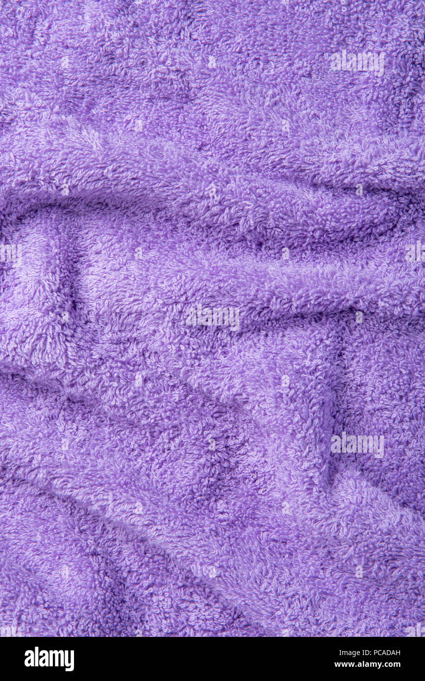 Texture of soft cotton fluffy purple towel as a beautiful background ...
