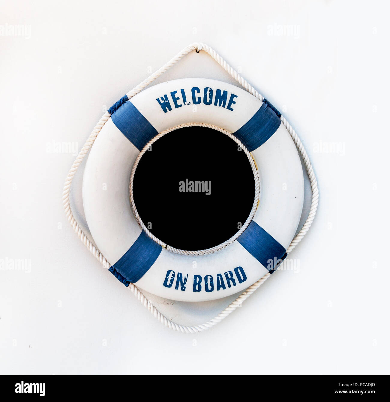 White and blue lifebuoy on white wall, float on the wall Stock Photo ...