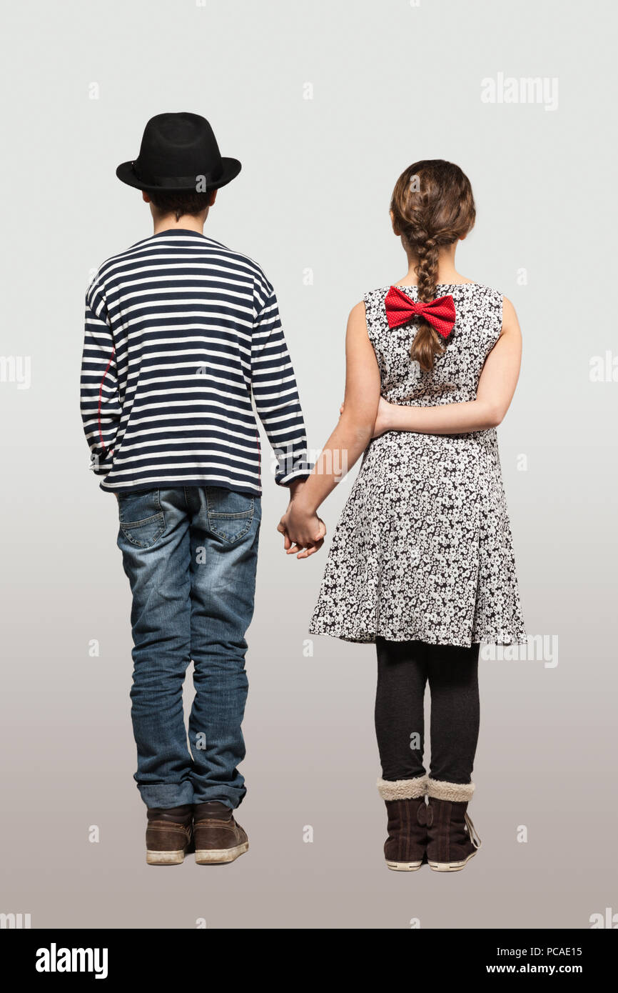 portrait of two children in studio, rear view Stock Photo - Alamy
