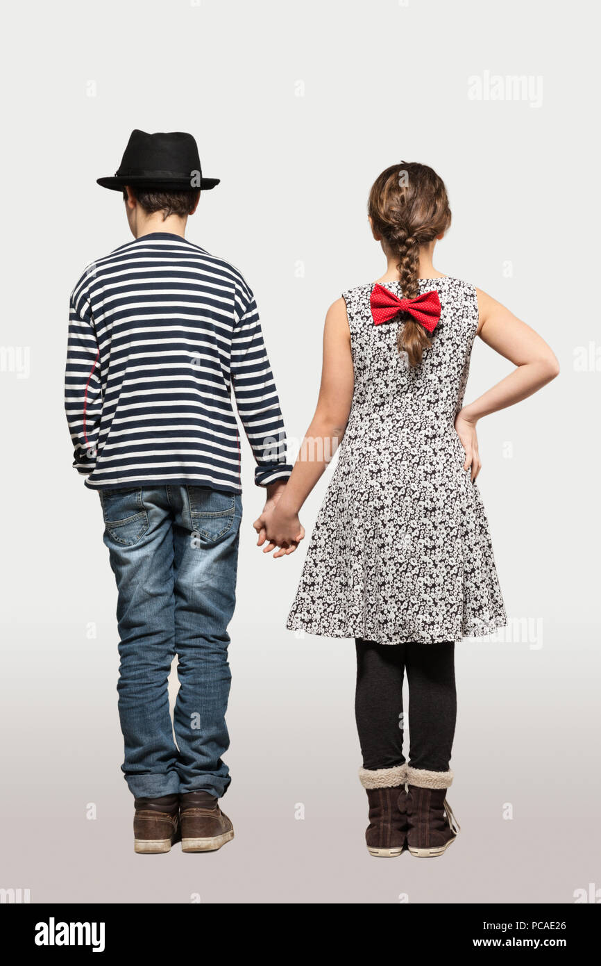 portrait of two children in studio, rear view Stock Photo - Alamy