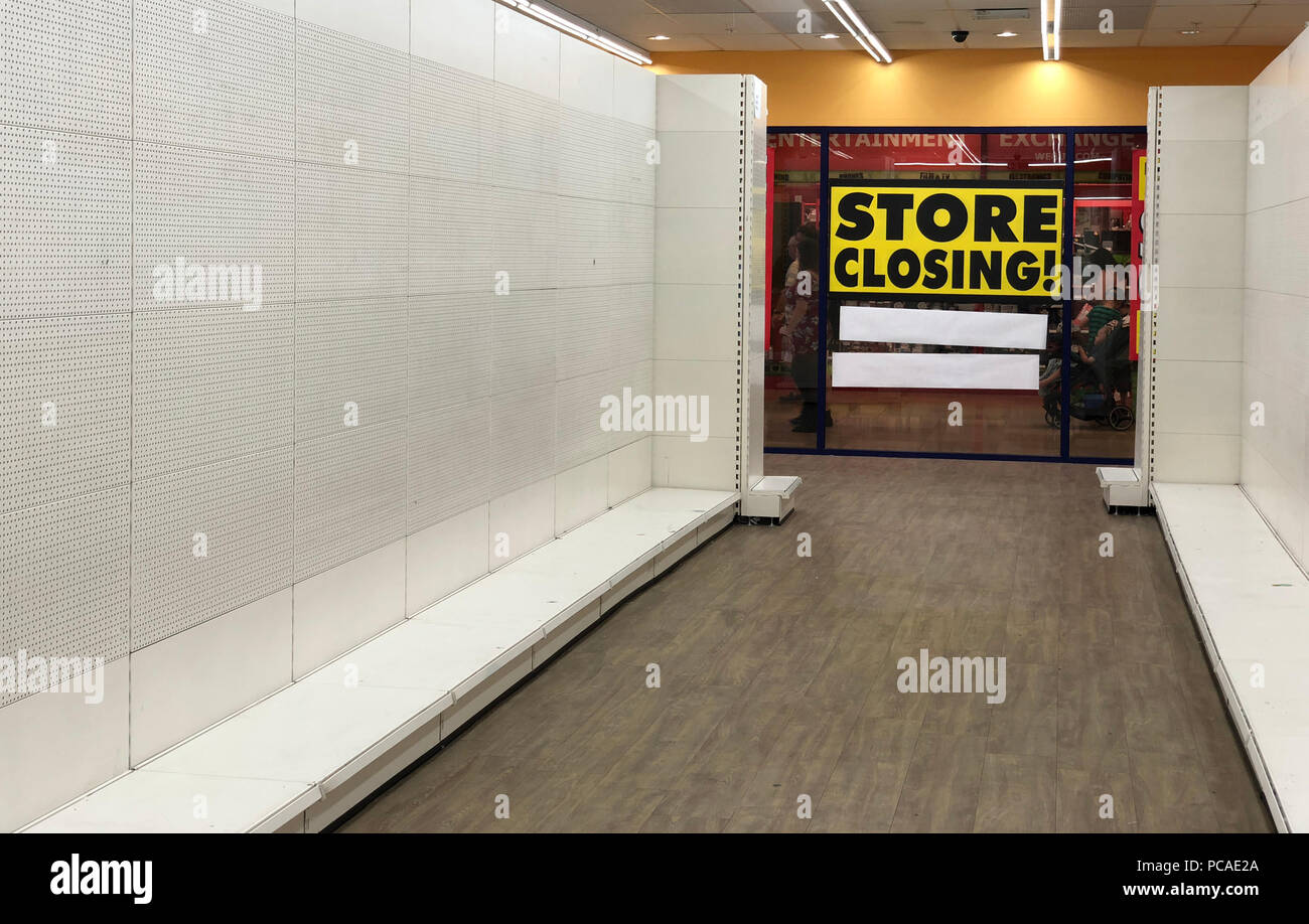 A general view of an empty Poundland store with empty shelves. The ...