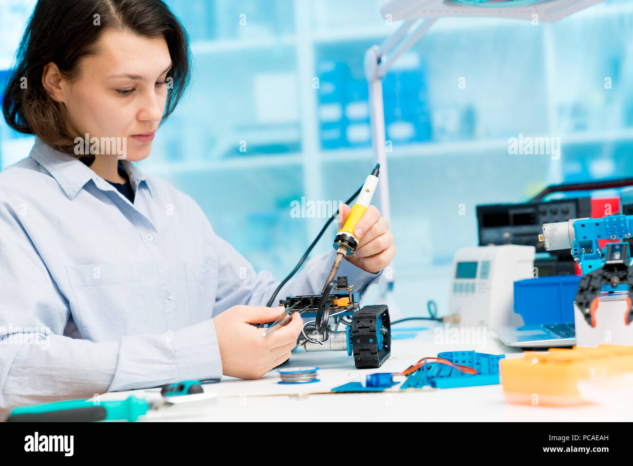 Young woman in CNC and robotics laboratory Stock Photo - Alamy