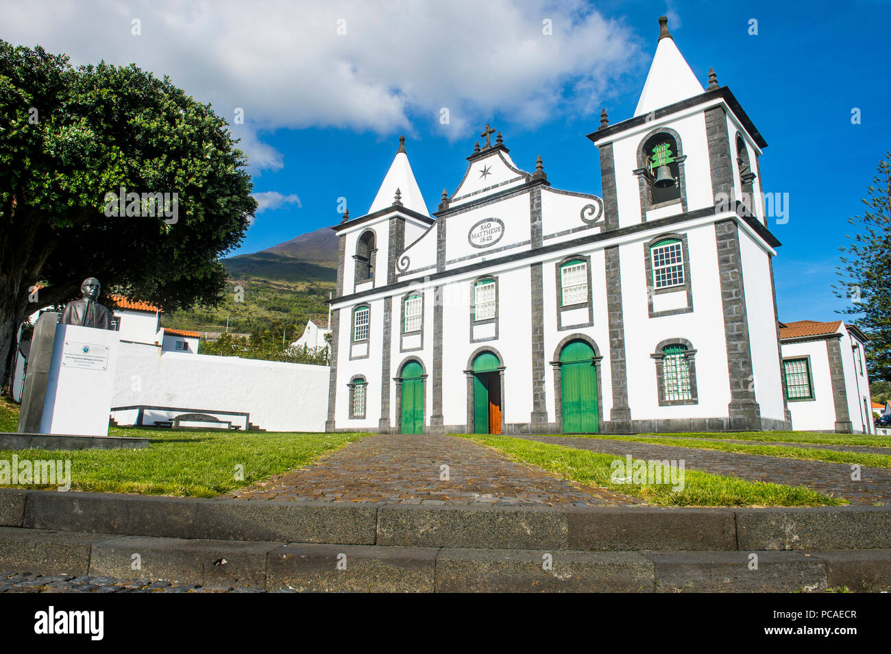 Paroquia de Sao Mateus church below Ponta do Pico, highest mountain of ...