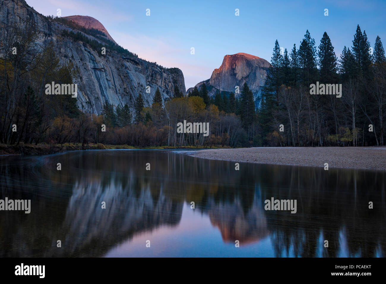 Half Dome mountain catches the last glow of sunset reflected in the ...