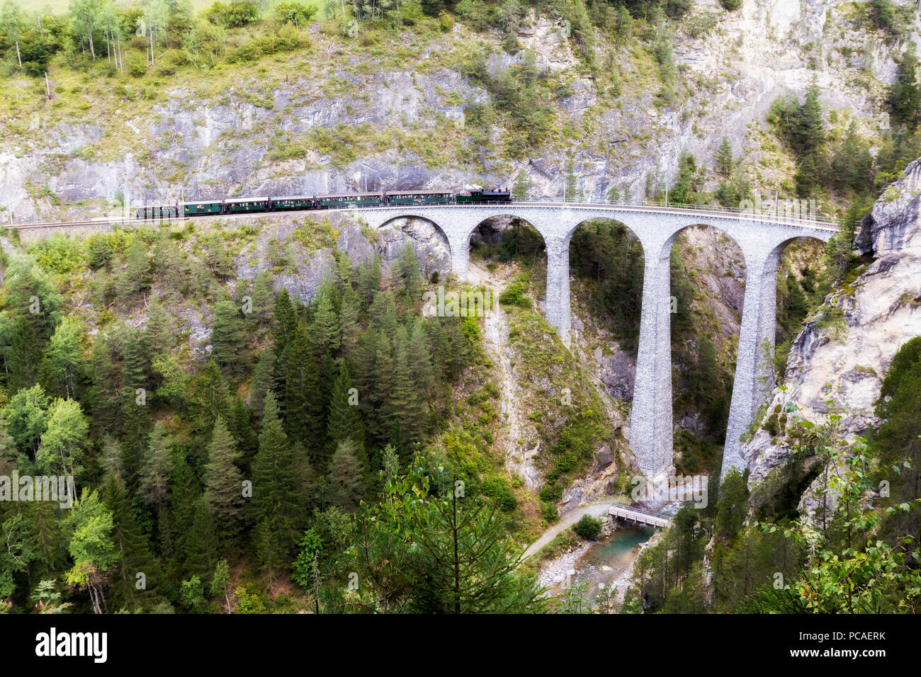 Steam train crosses the Landwasser Viadukt, UNESCO World Heritage Site ...