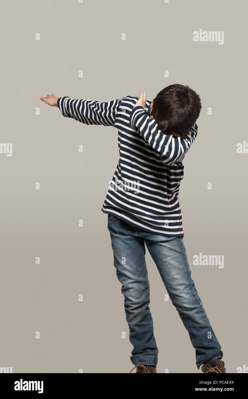 Guy making Dab, portrait in studio, isolated on gray background Stock ...