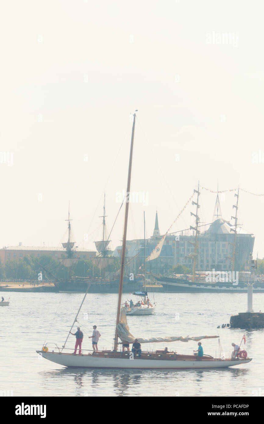 Sailboat on a hot summer day at the regatta in the Daugava River in the ...