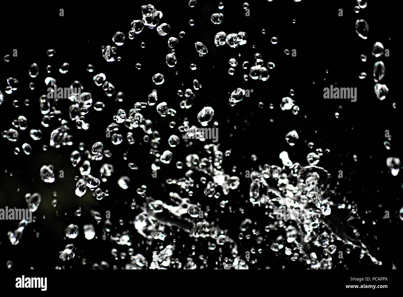 Falling and flying water drops from a Fountain frozen in time Stock ...