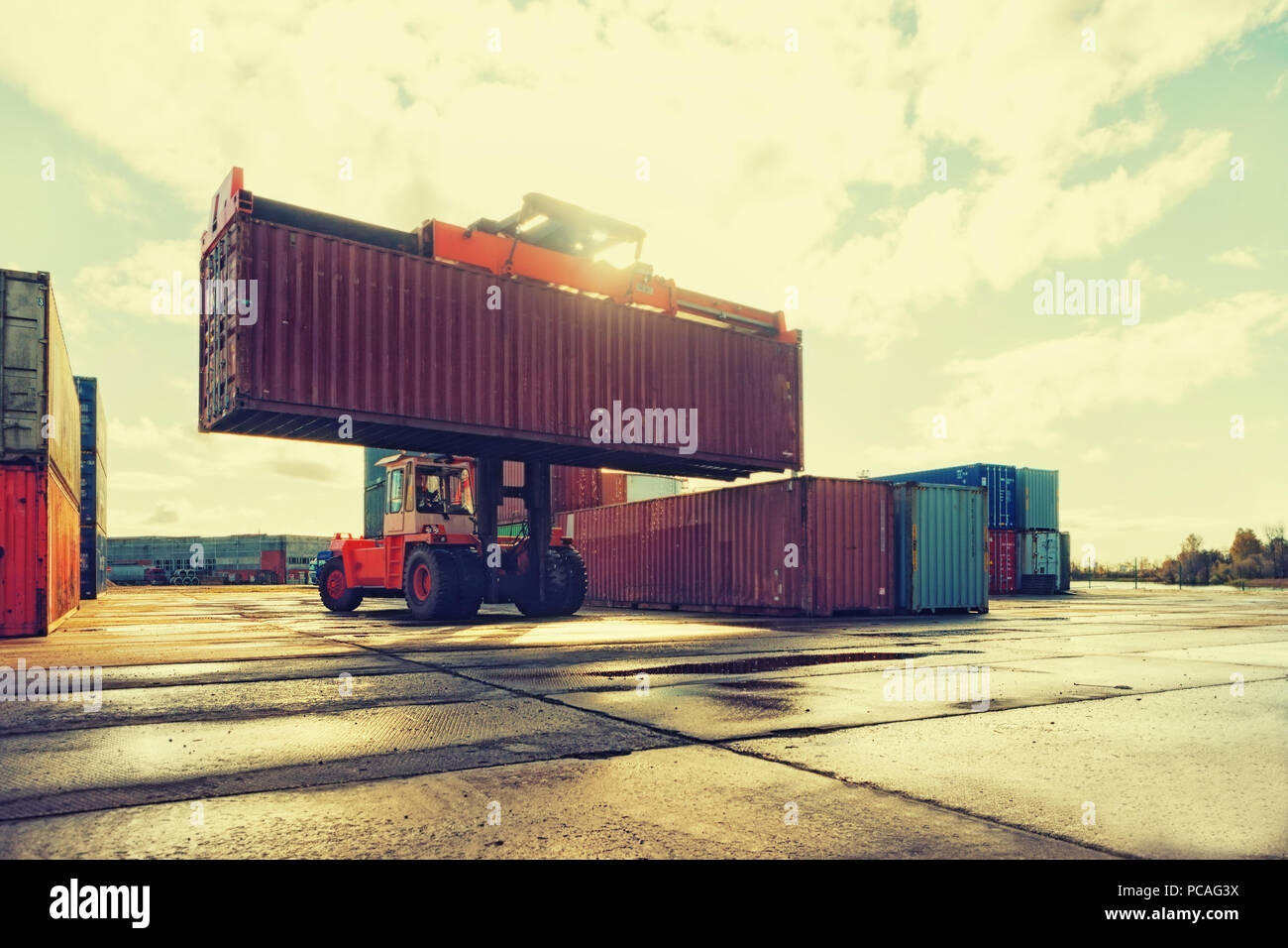 Loading and unloading of containers in the port on a bright sunny day ...