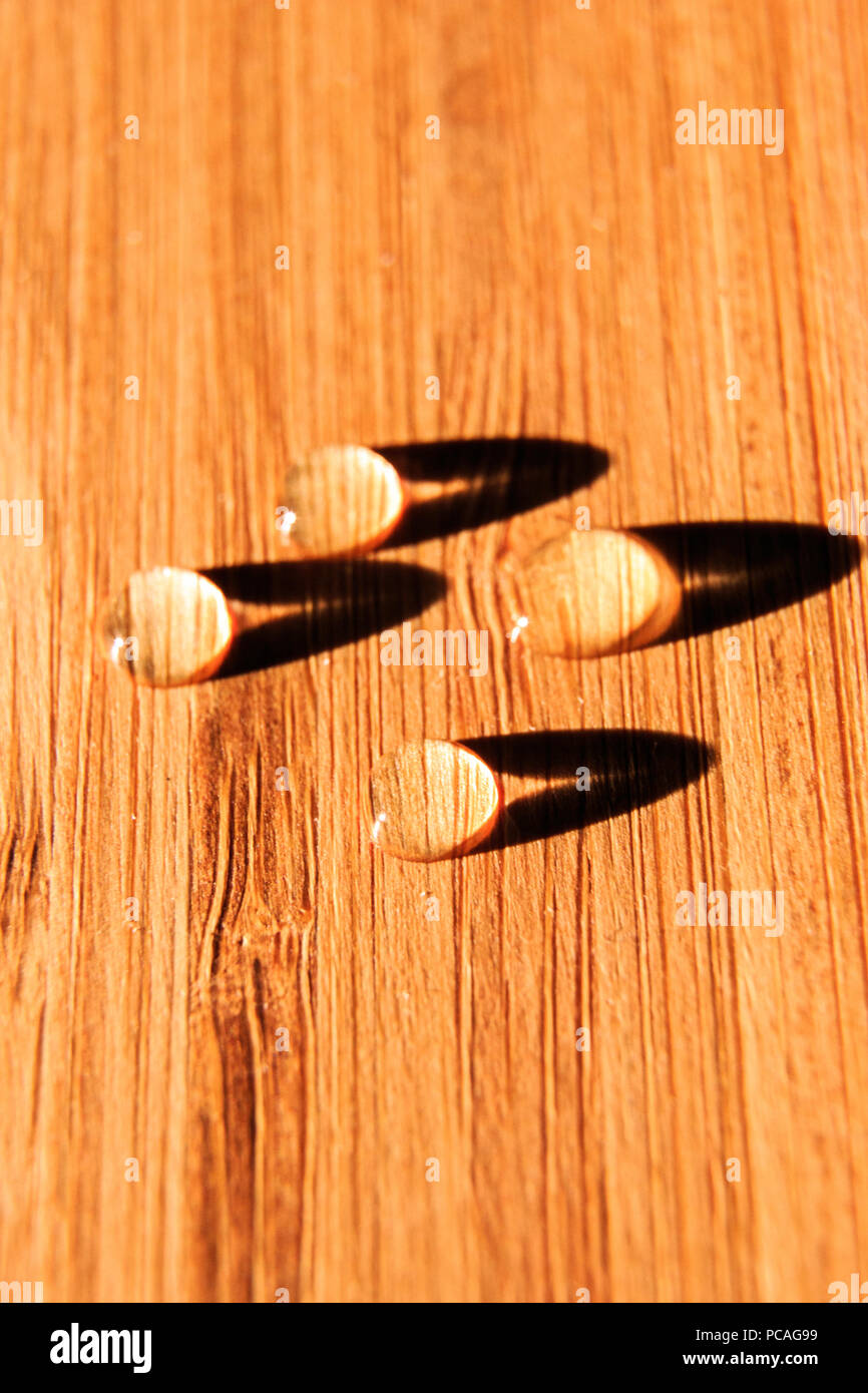 Water Drops in a Wood Table Stock Photo - Alamy