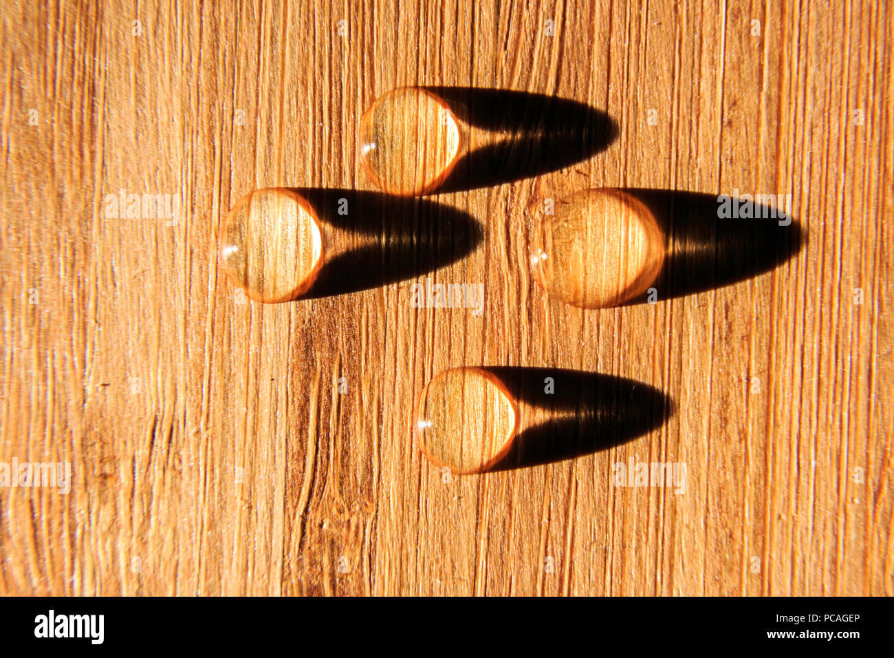 Water Drops in a Wood Table Stock Photo - Alamy