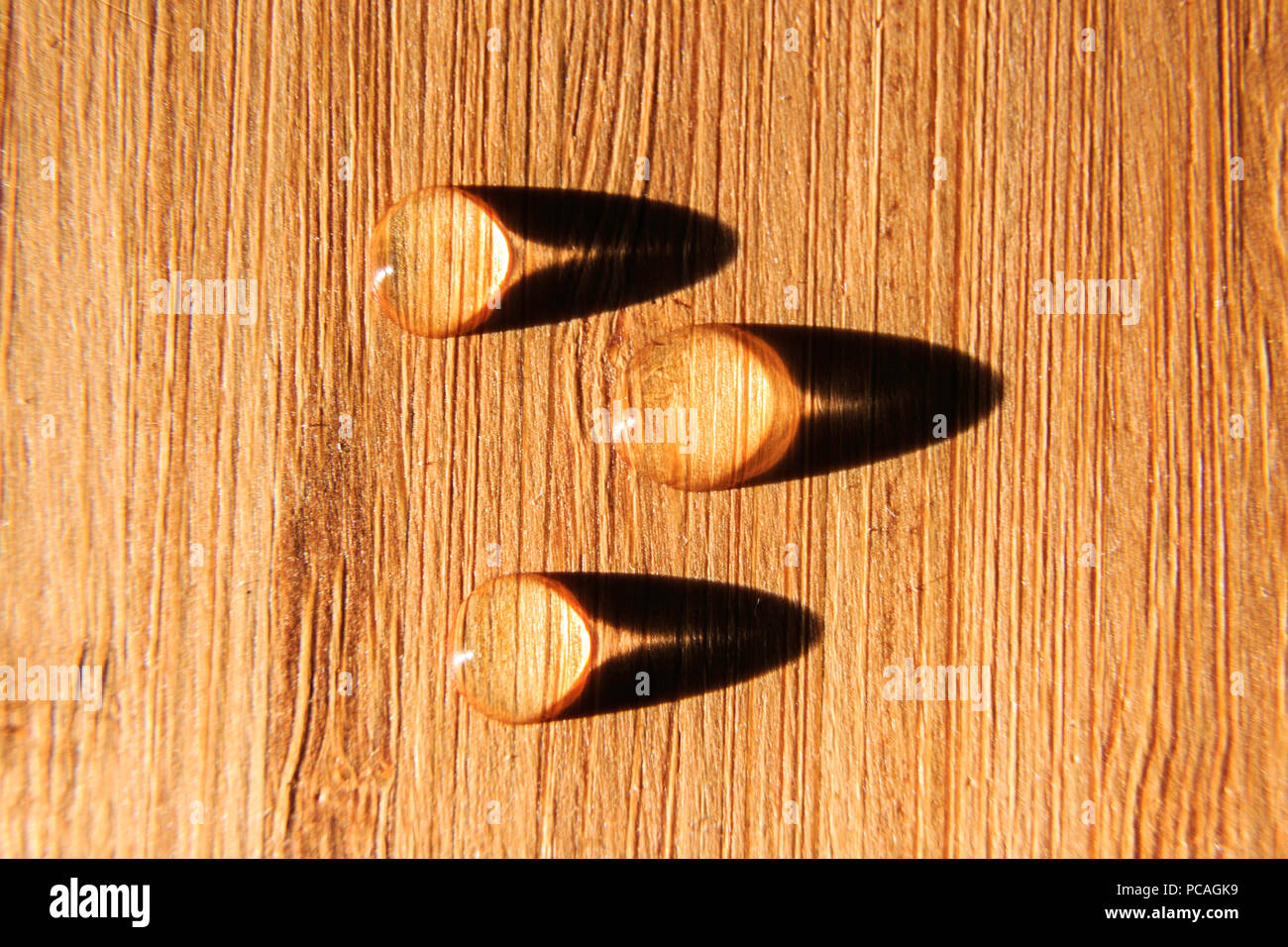 Water Drops in a Wood Table Stock Photo - Alamy