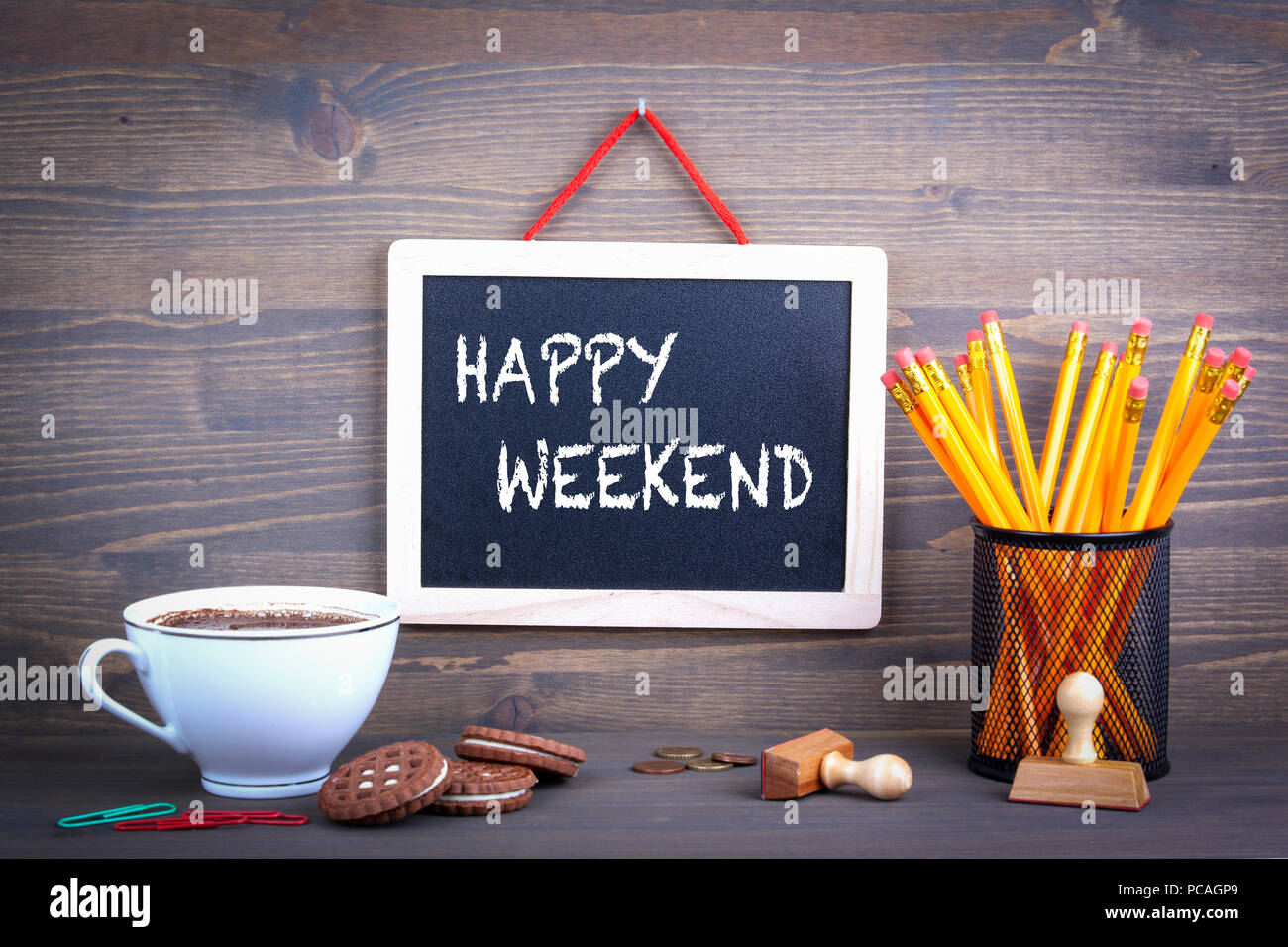 happy weekend. chalkboard on a wooden background Stock Photo - Alamy
