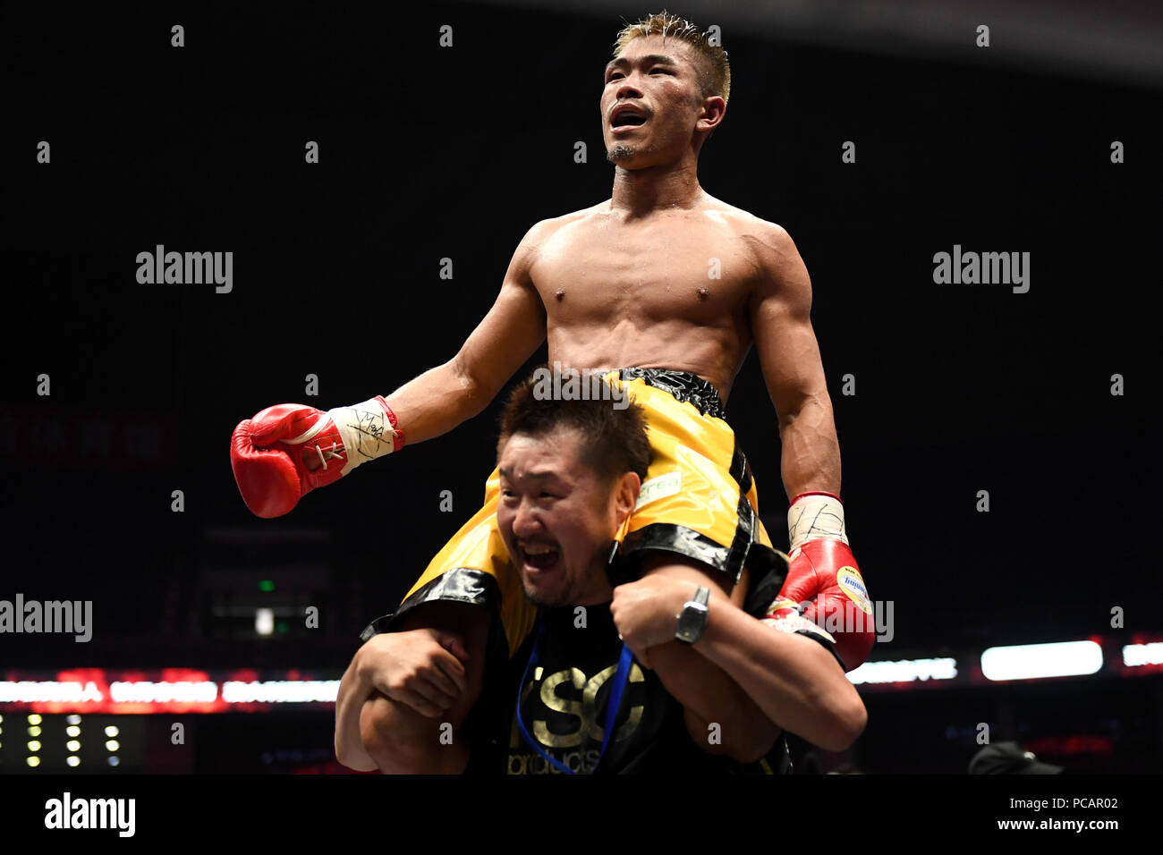 Qingdao, China. 31st July, 2018. Japanese boxer Sho Kimura Sho defeats ...