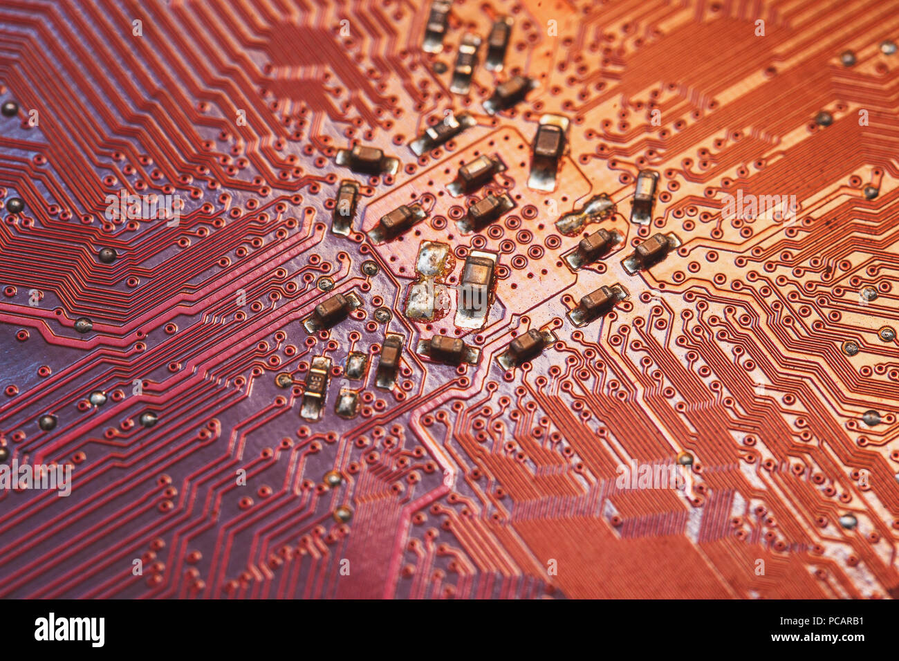 Computer red electronic microcircuits concept background macro closeup ...