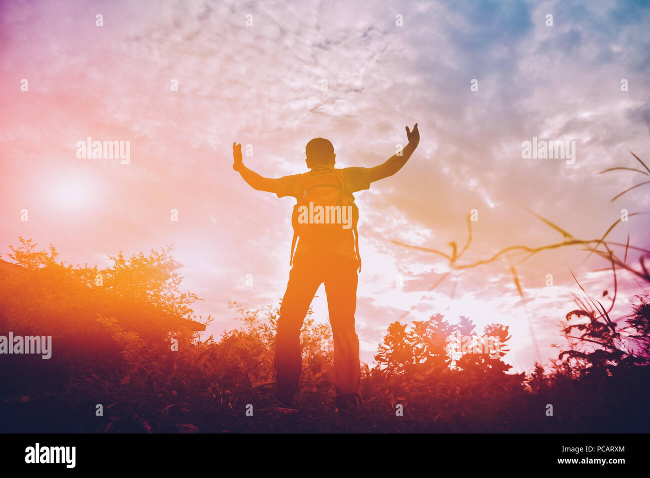 Man standing on mountain sunlight background design for texture concept ...