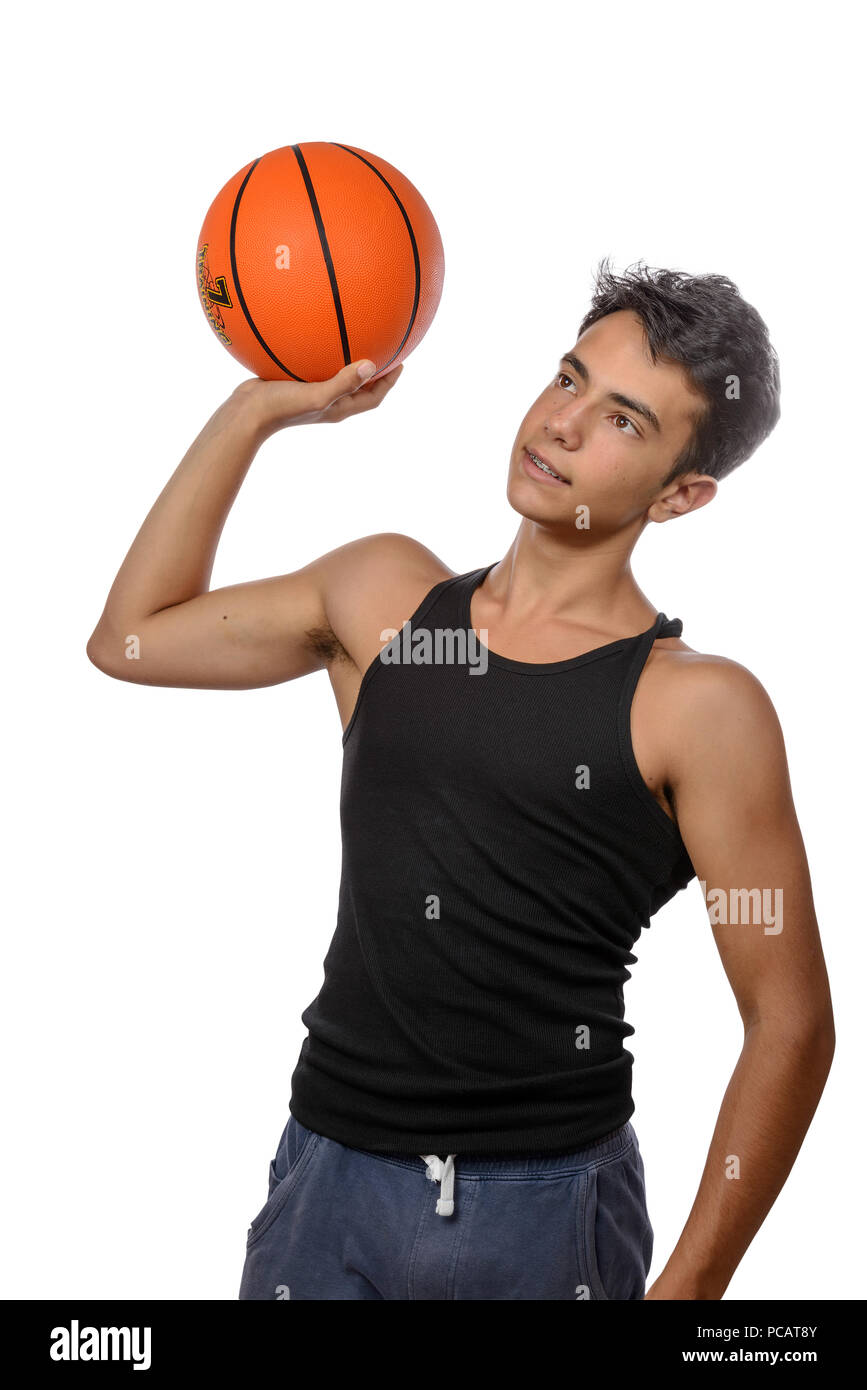 Portrait of a young basketball player passing the ball. Young caucasian ...