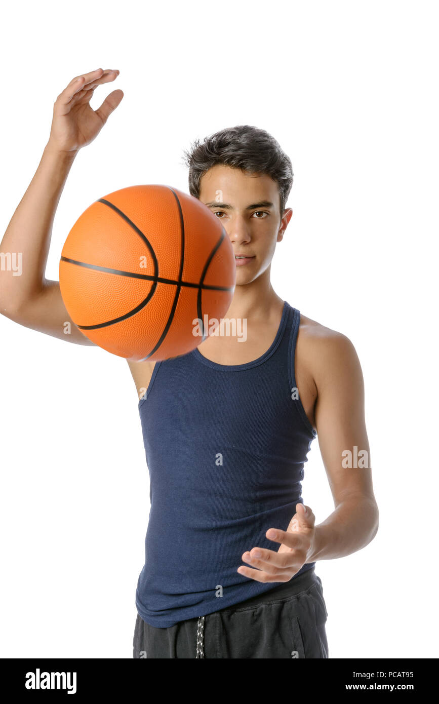 Portrait of a young basketball player passing the ball. Young caucasian ...