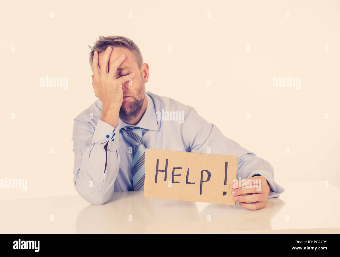 Young attractive frustrated and tired caucasian businessman holding ...