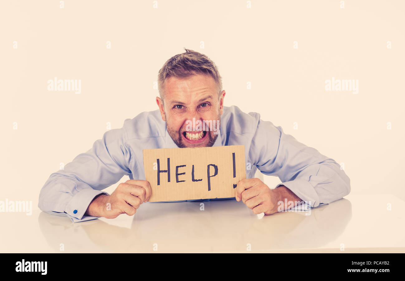 Young attractive frustrated and tired caucasian businessman holding ...