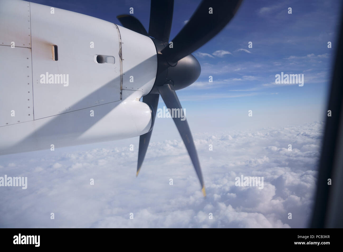 Propeller Airplane and Cloud Stock Photo - Alamy