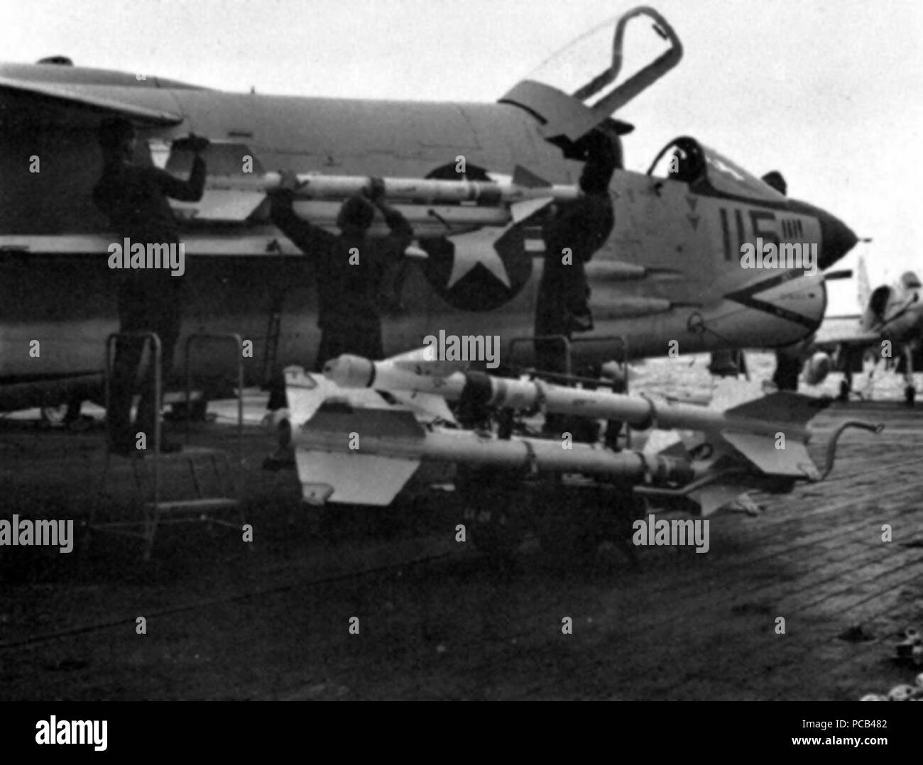 AIM-9s loaded on F-8E on USS Ticonderoga (CVA-14 Stock Photo - Alamy