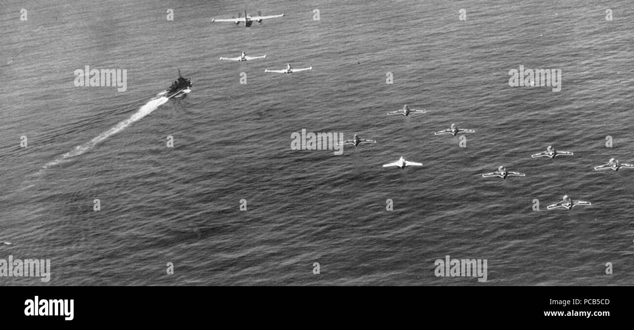 Aircraft of U.S. Navy Air Task Group 3 in flight over a destroyer, in ...