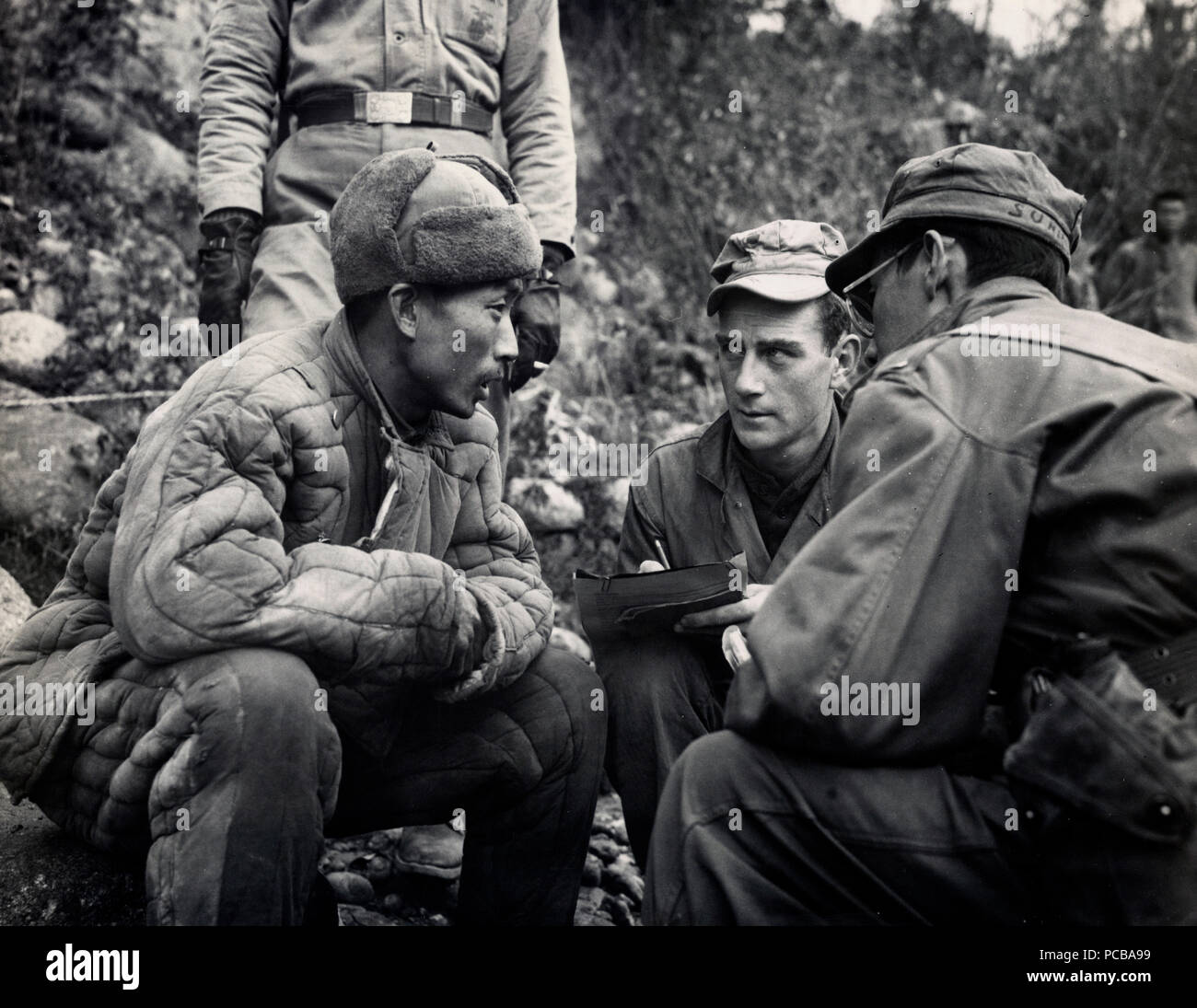 Questioning a Chinese communist officer captured in Korea Stock Photo ...