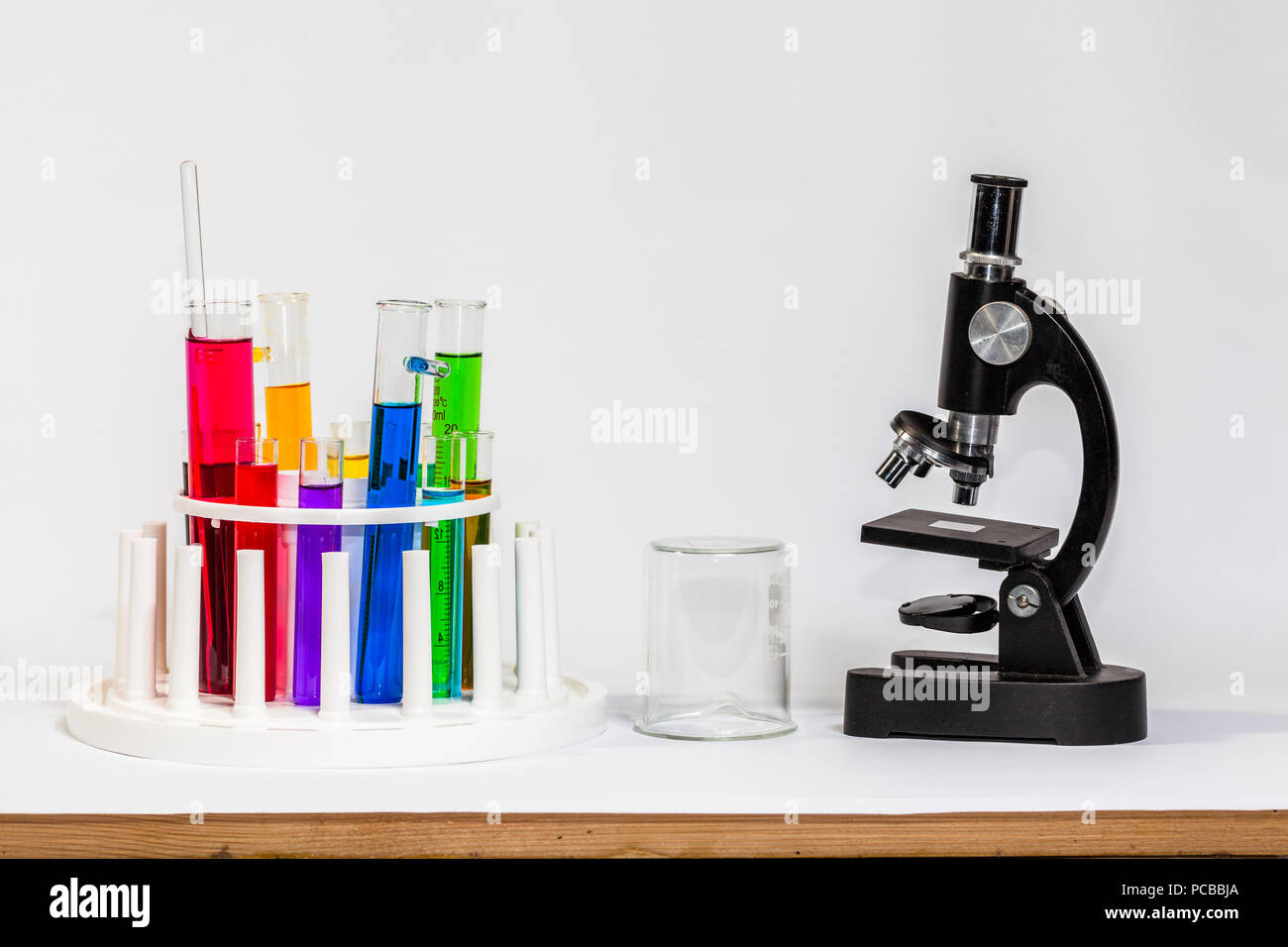 Experiments in mixing chemical substances into glass tubes with a ...