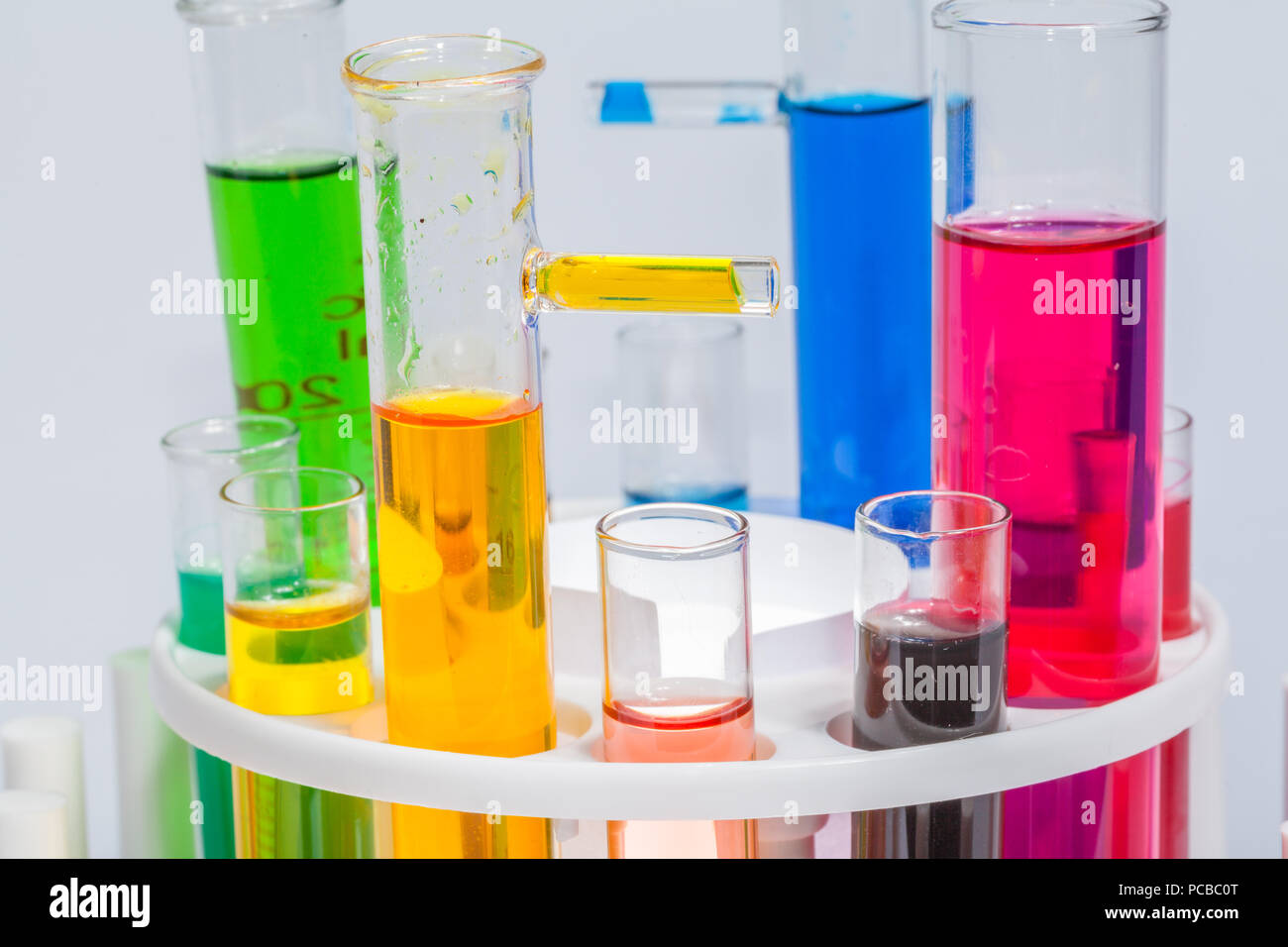 Experiments in mixing chemical substances into glass tubes with a ...