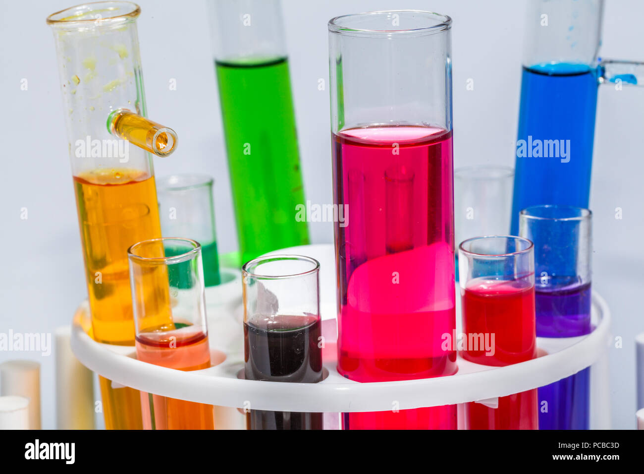 Experiments in mixing chemical substances into glass tubes with a ...