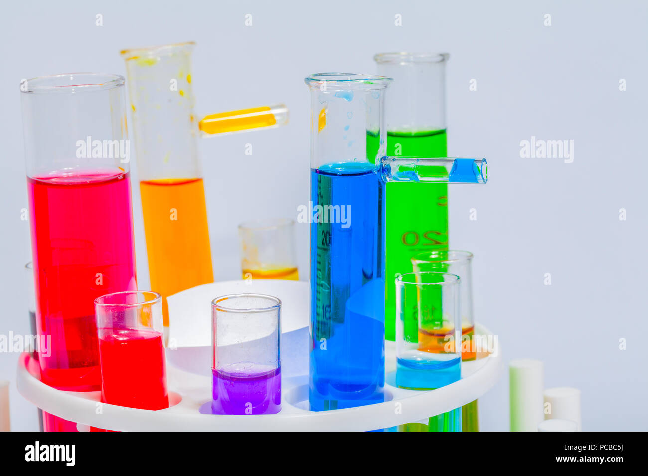 Experiments in mixing chemical substances into glass tubes with a ...