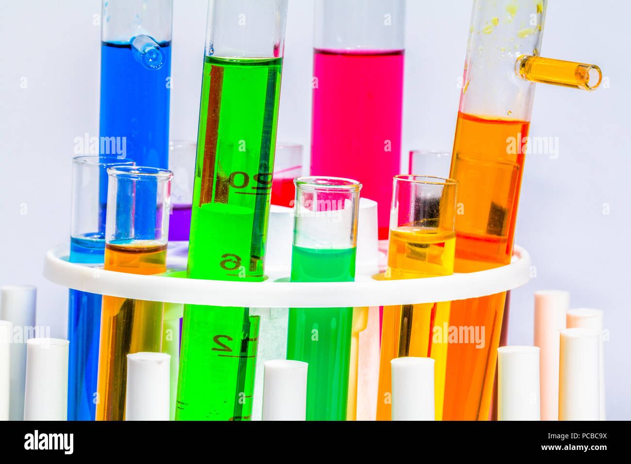 Experiments in mixing chemical substances into glass tubes with a ...