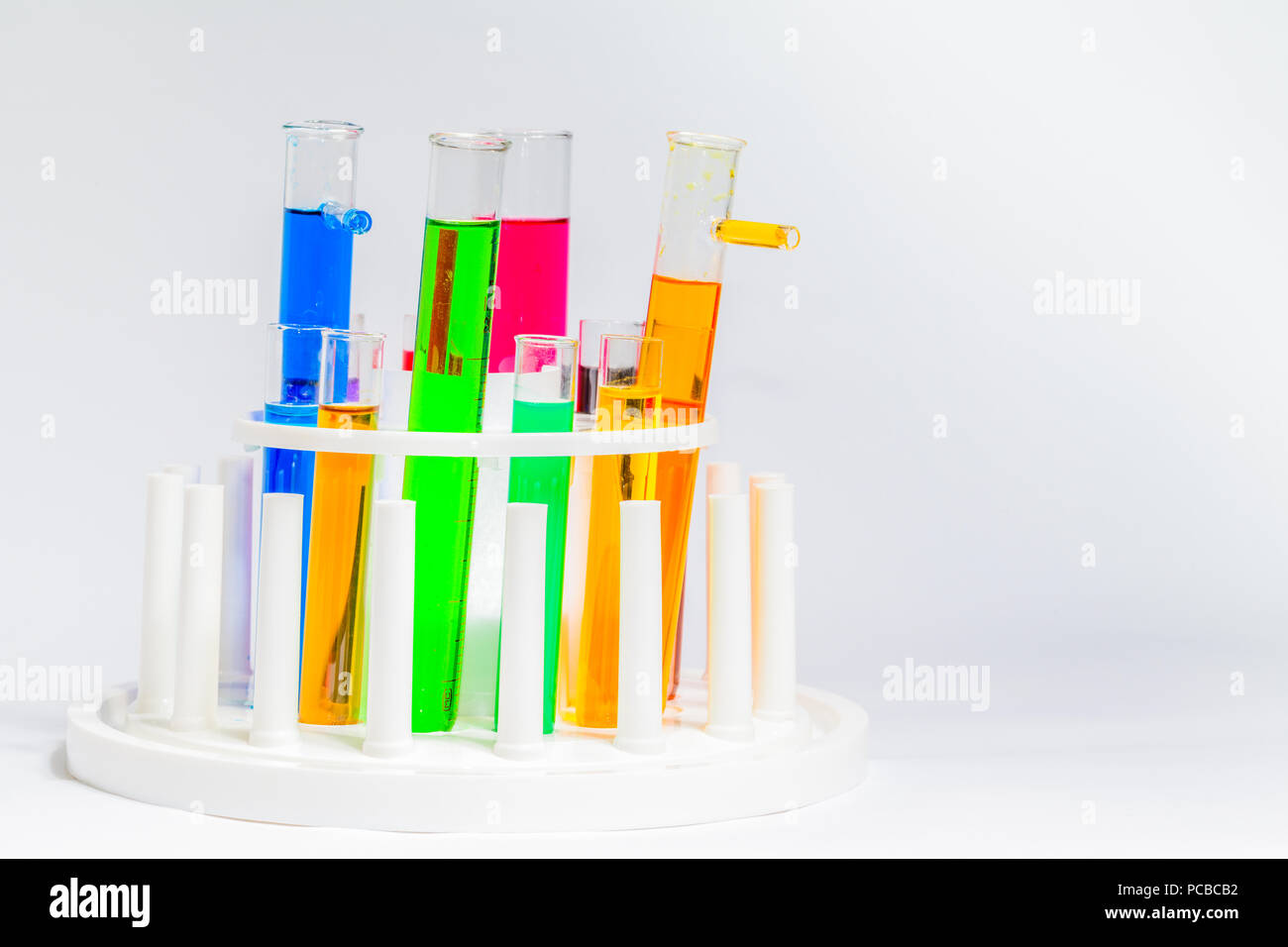 Experiments in mixing chemical substances into glass tubes with a ...
