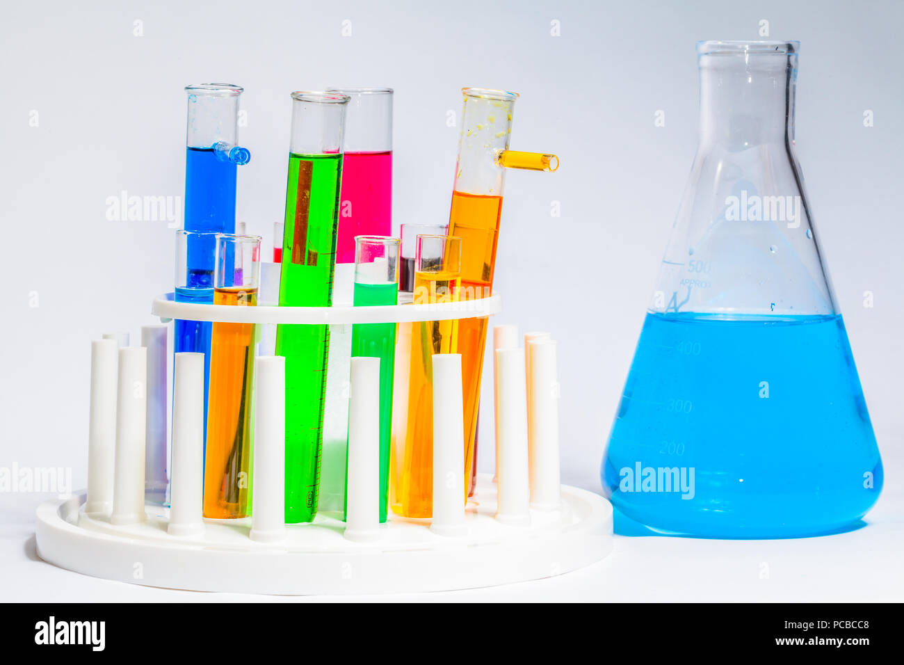 Experiments in mixing chemical substances into glass tubes with a ...