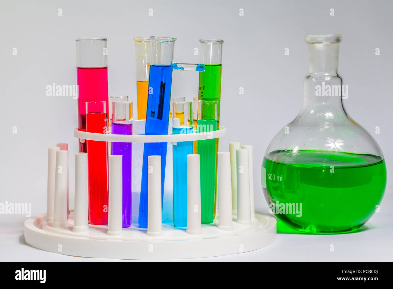 Experiments in mixing chemical substances into glass tubes with a ...