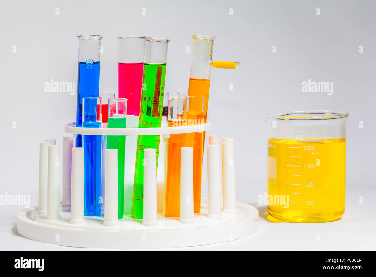 Experiments in mixing chemical substances into glass tubes with a ...