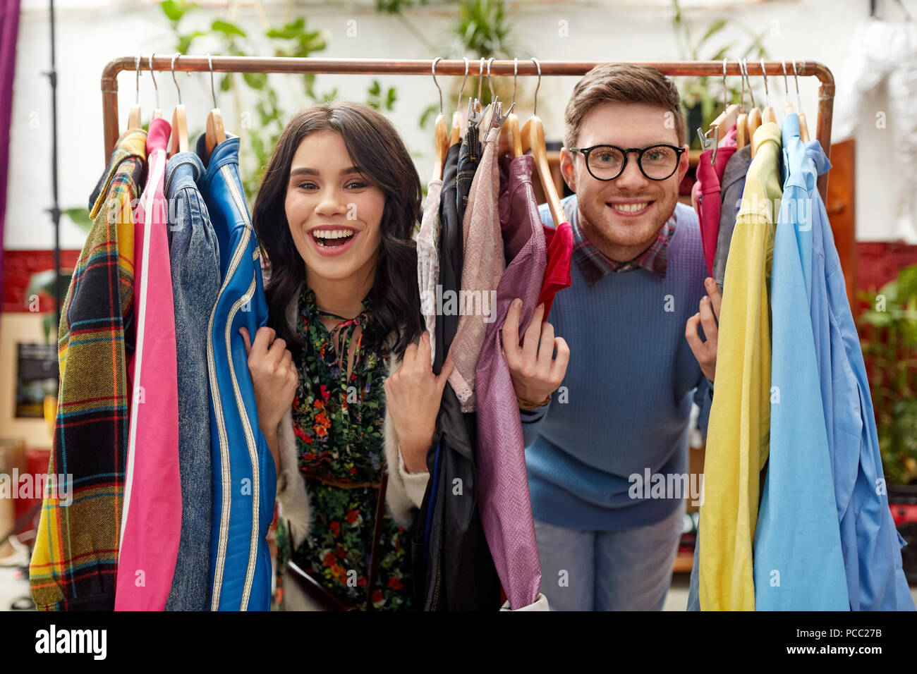 happy couple having fun at vintage clothing store Stock Photo - Alamy