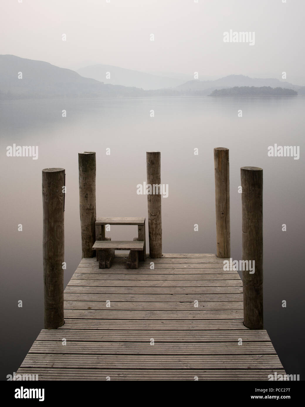 Derwentwater pier jetty mist fog sunset Lake District UK calm peaceful ...