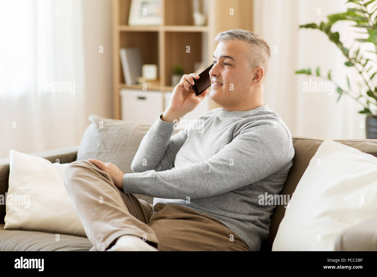 Mature adult hispanic man talking hi-res stock photography and images ...