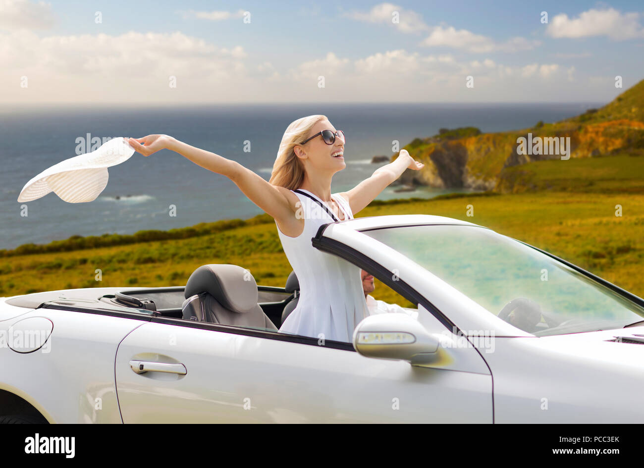 happy couple driving in convertible car Stock Photo - Alamy
