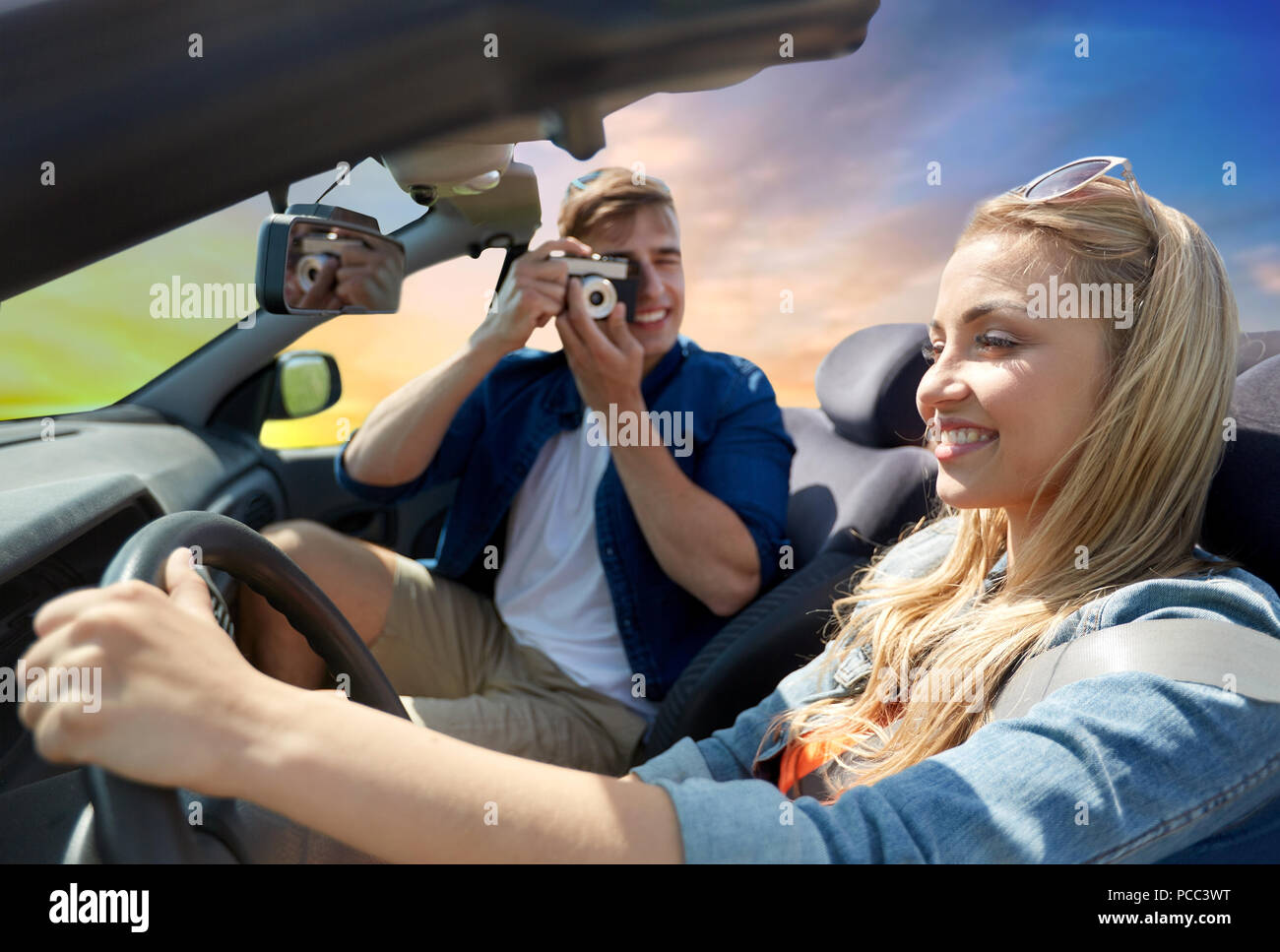 man photographing woman driving car by film camera Stock Photo - Alamy