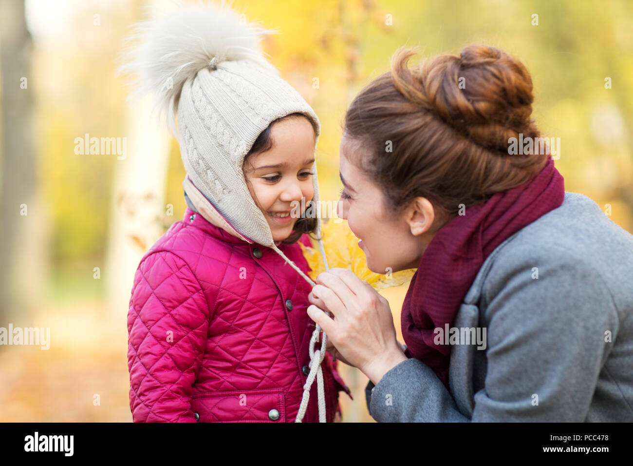 happy mother and little daughter at autumn park Stock Photo - Alamy